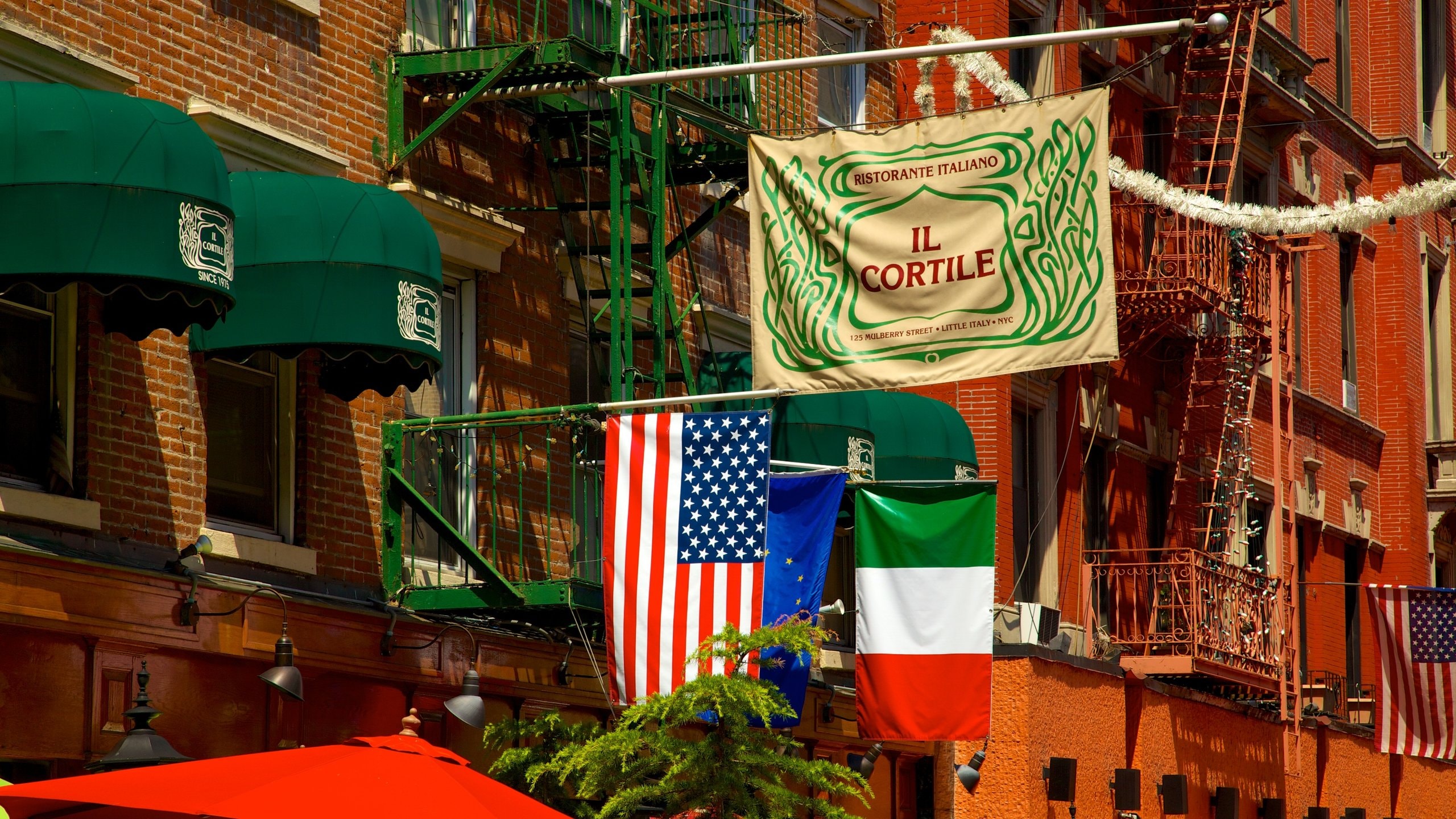 Restaurant And Italian Flags At Little Italy In New York