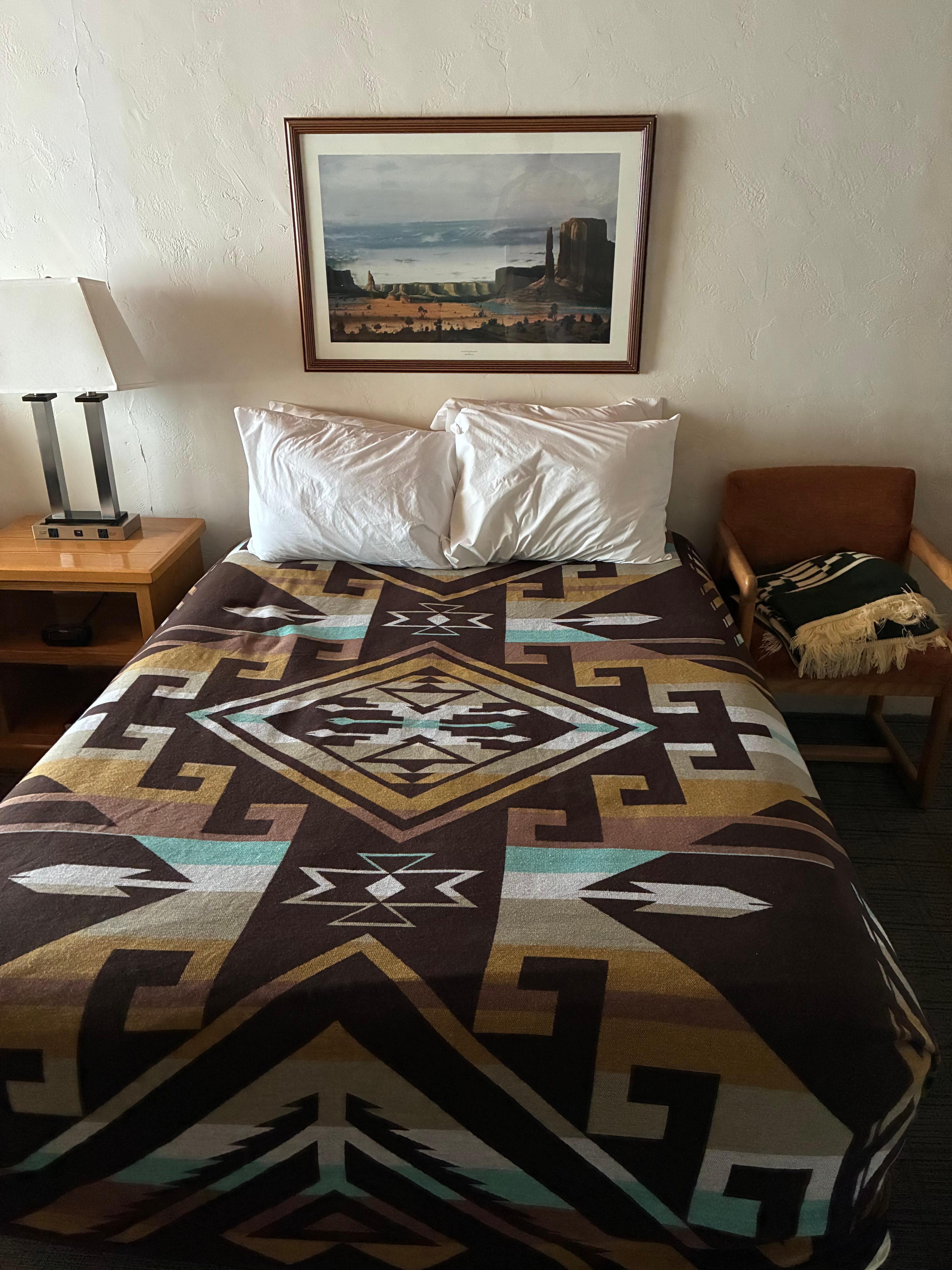 Each room is Southwestern style but the individual details (comforter, artwork) are unique to the room.