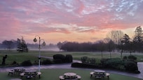 Winter morning view from outside lounge across golf course.