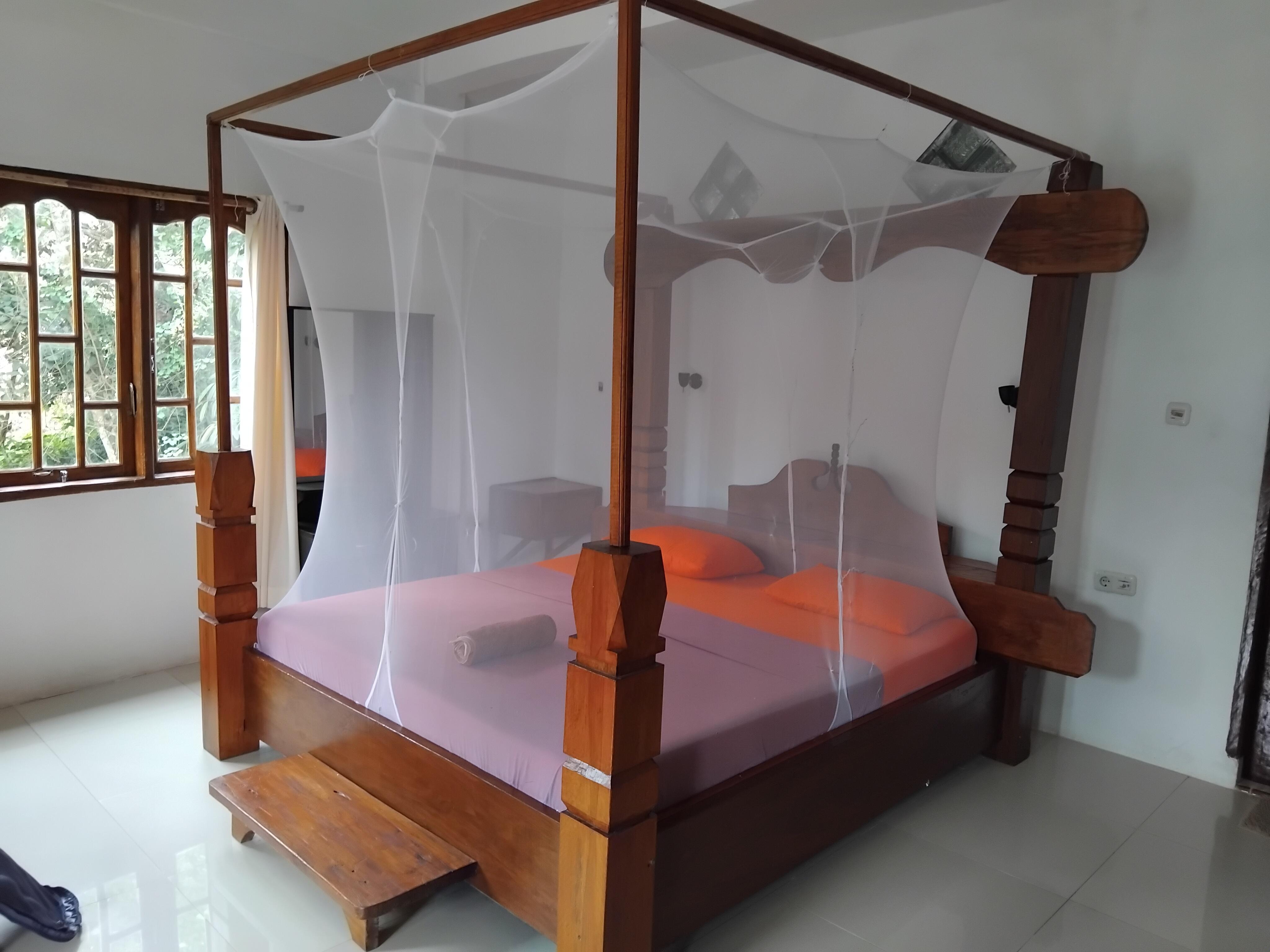 Lush comfy king-size bed with full mosquito  protection 