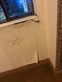 Water damage and wallpaper peeling off