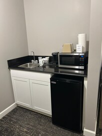 Small coffee pot with coffee and condiments. You may want to bring extra