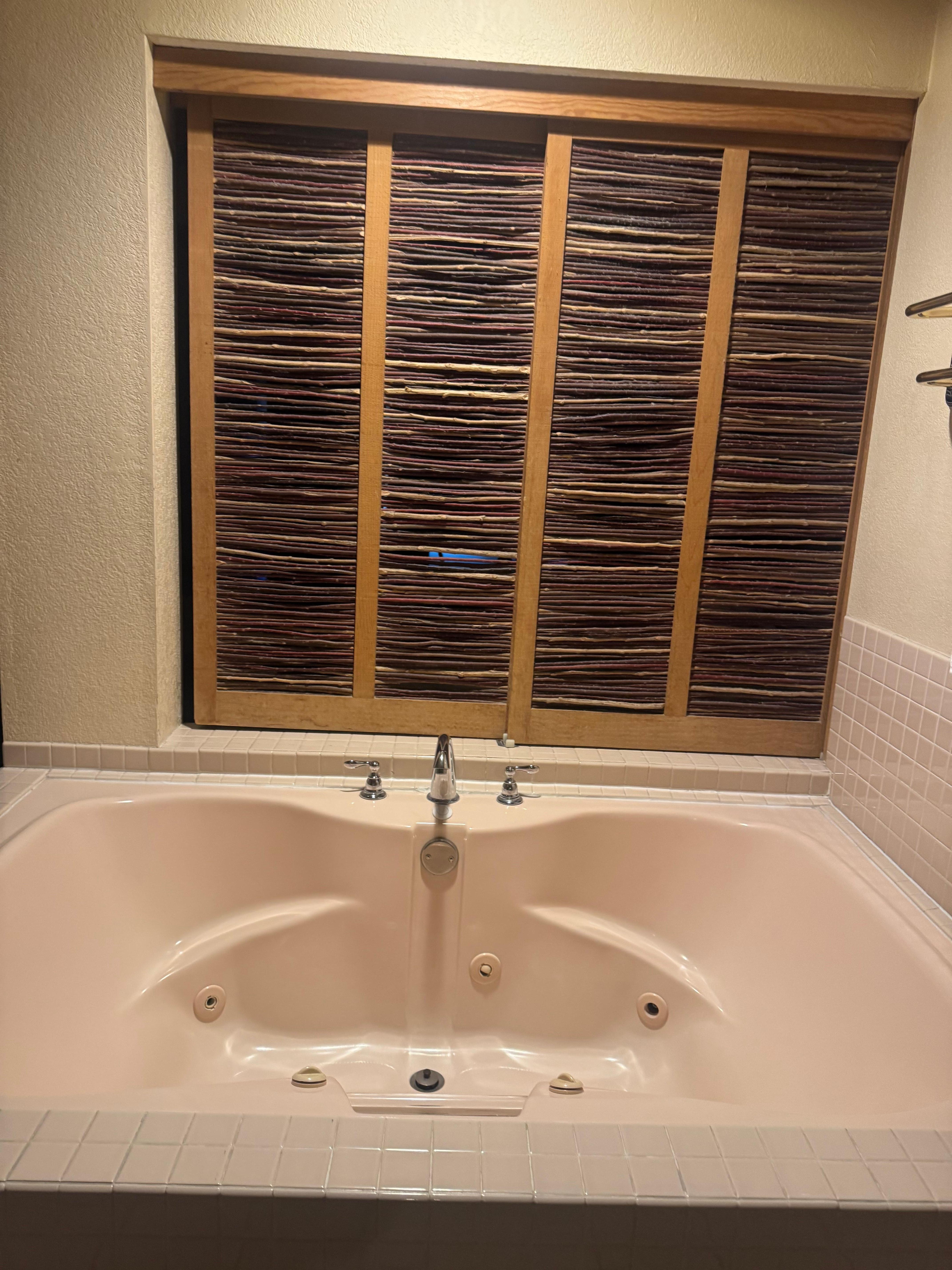 Includes jacuzzi tub.