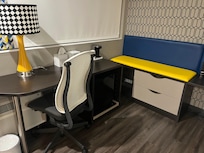 Fridge ,desk , microwave, iron and ironing board