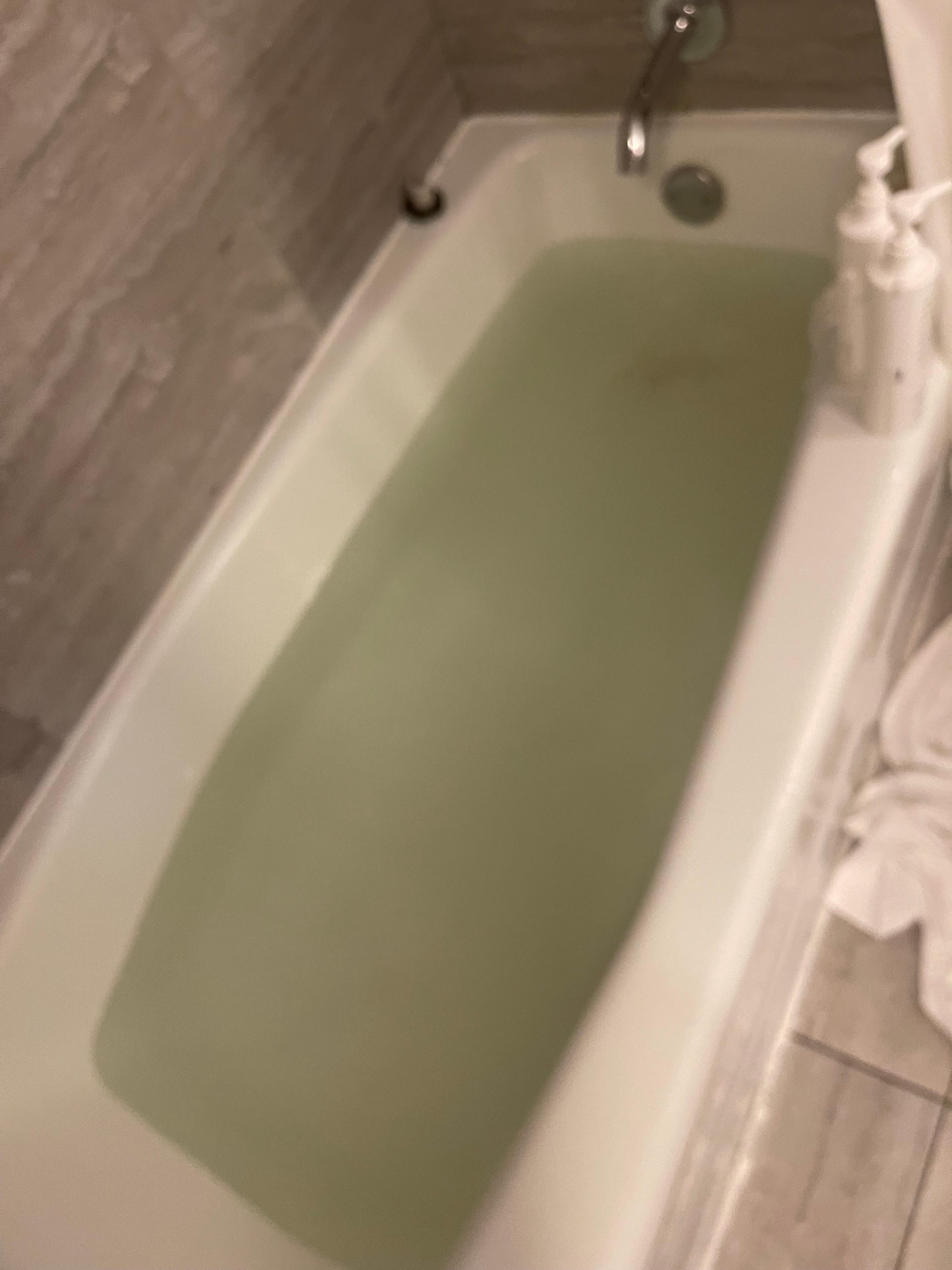 tub filled with dirty water that came from the faucet