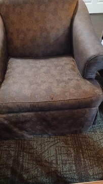 Chair was torn & appeared that they may have tried to sew it together