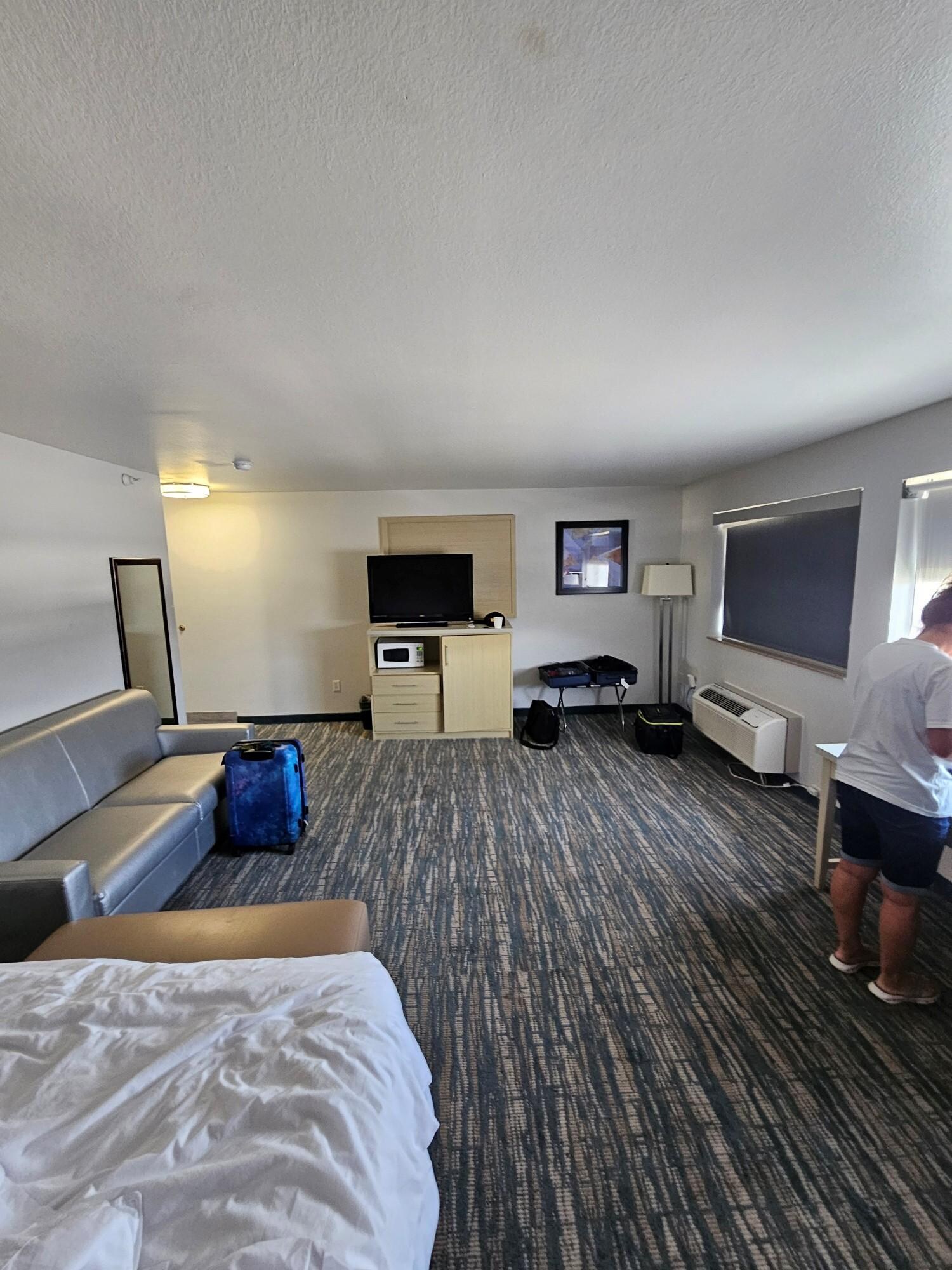 Room set up weird, tiny TV way too far from bed.