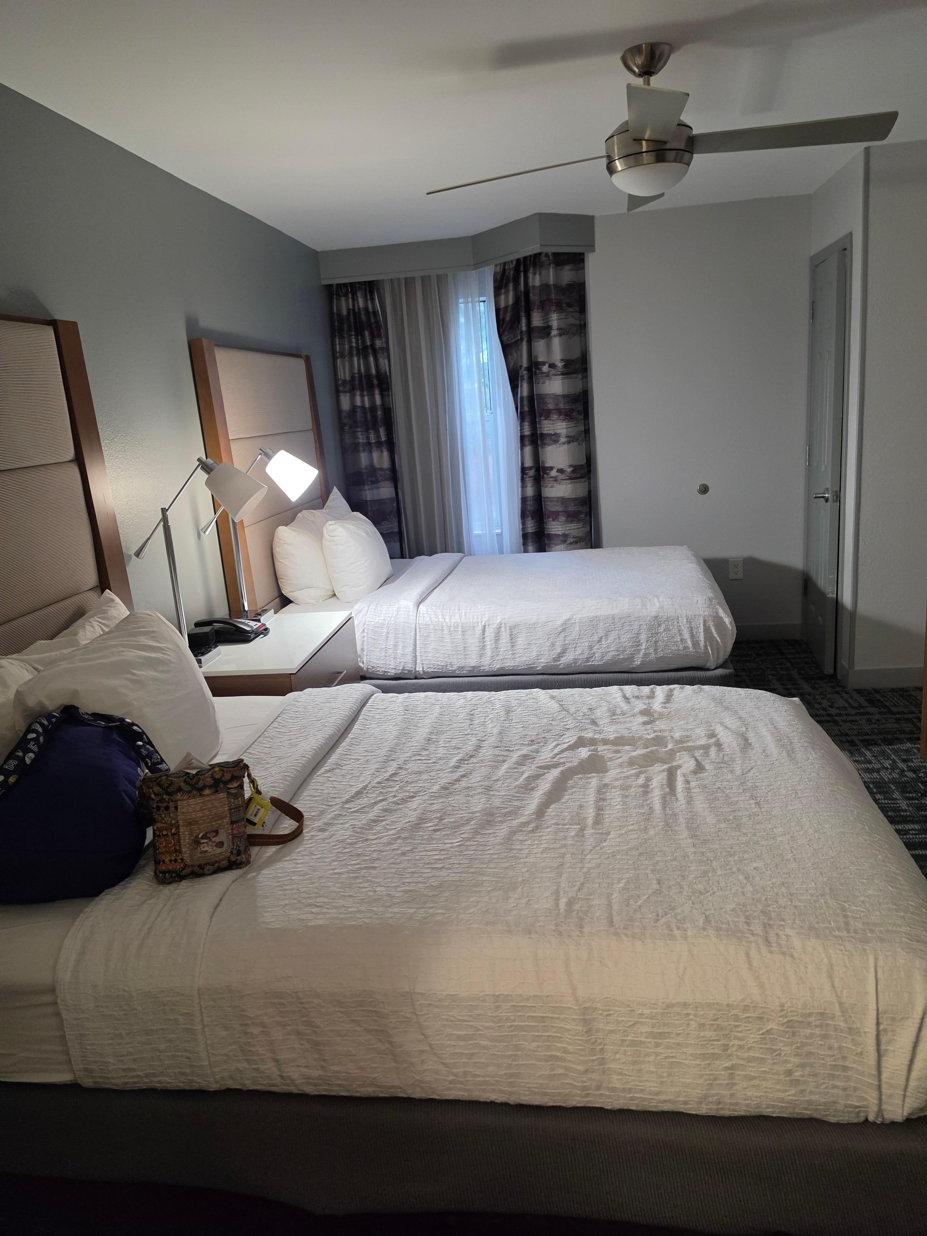 The bedroom has a sliding door