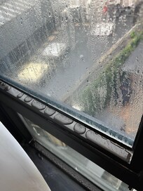 Window in the morning with condensation water