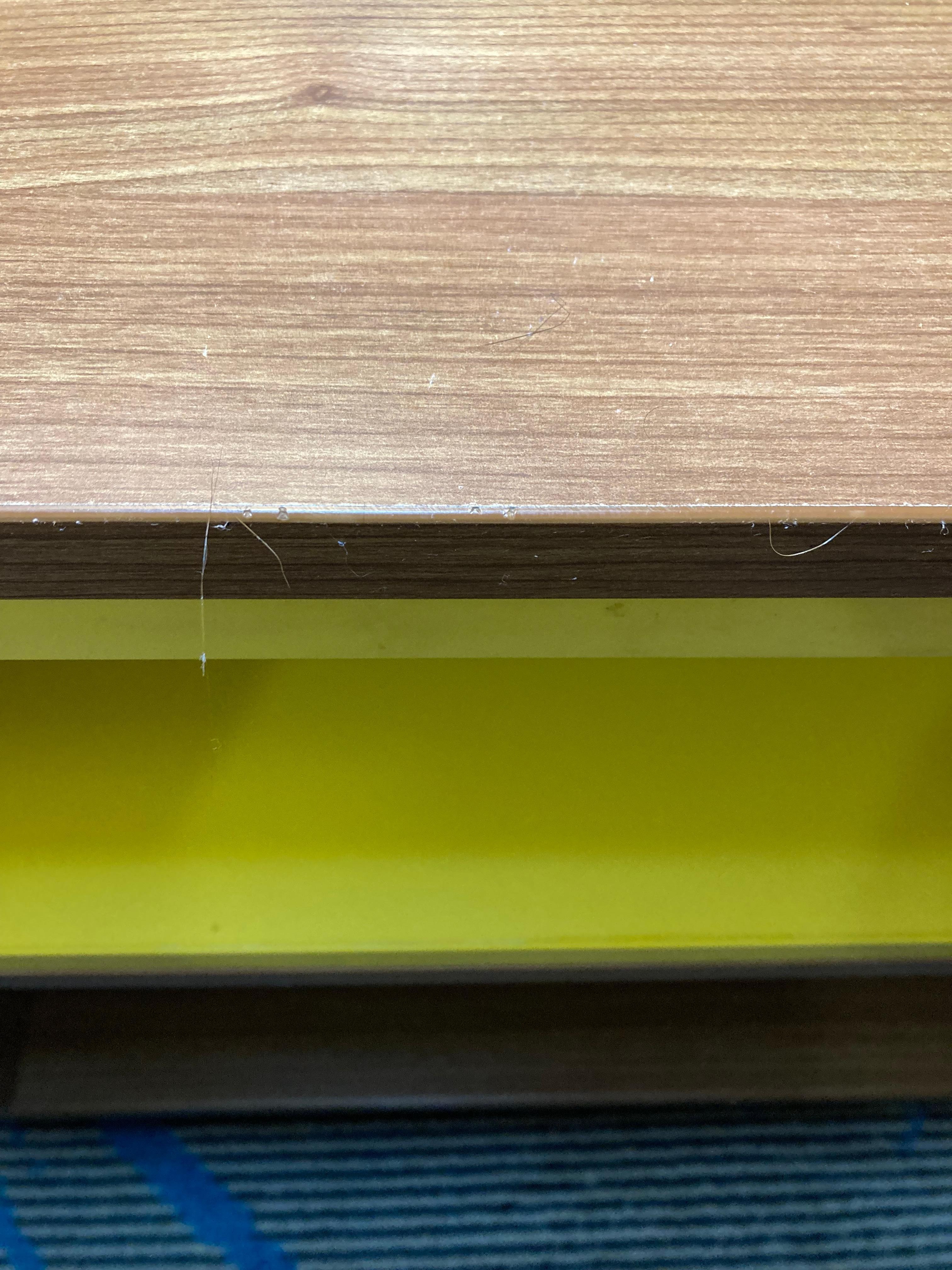 Hair stuck to the edge of the night stand