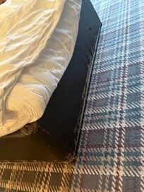 Bed base flaking and peeling which will make it difficult to clean and will harbour germs.