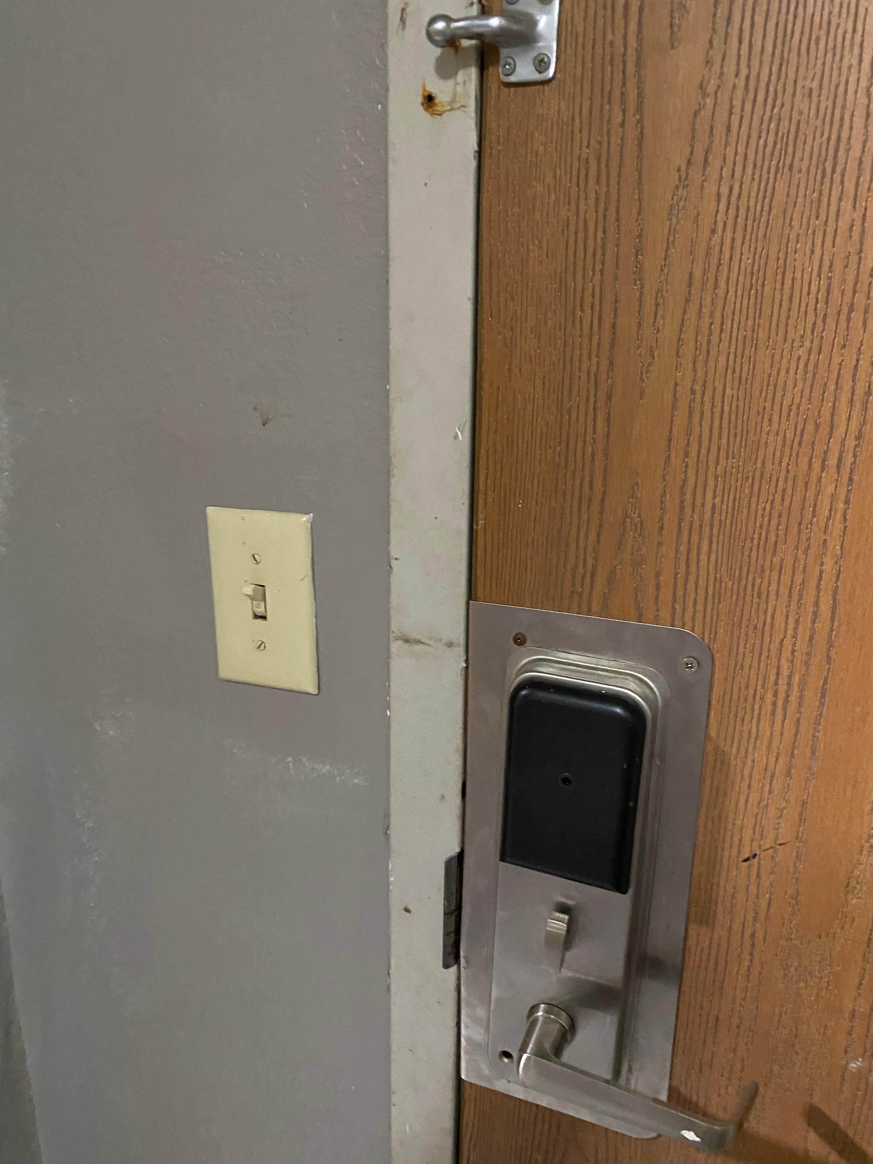 No latch for security. We pushed the chair against the door