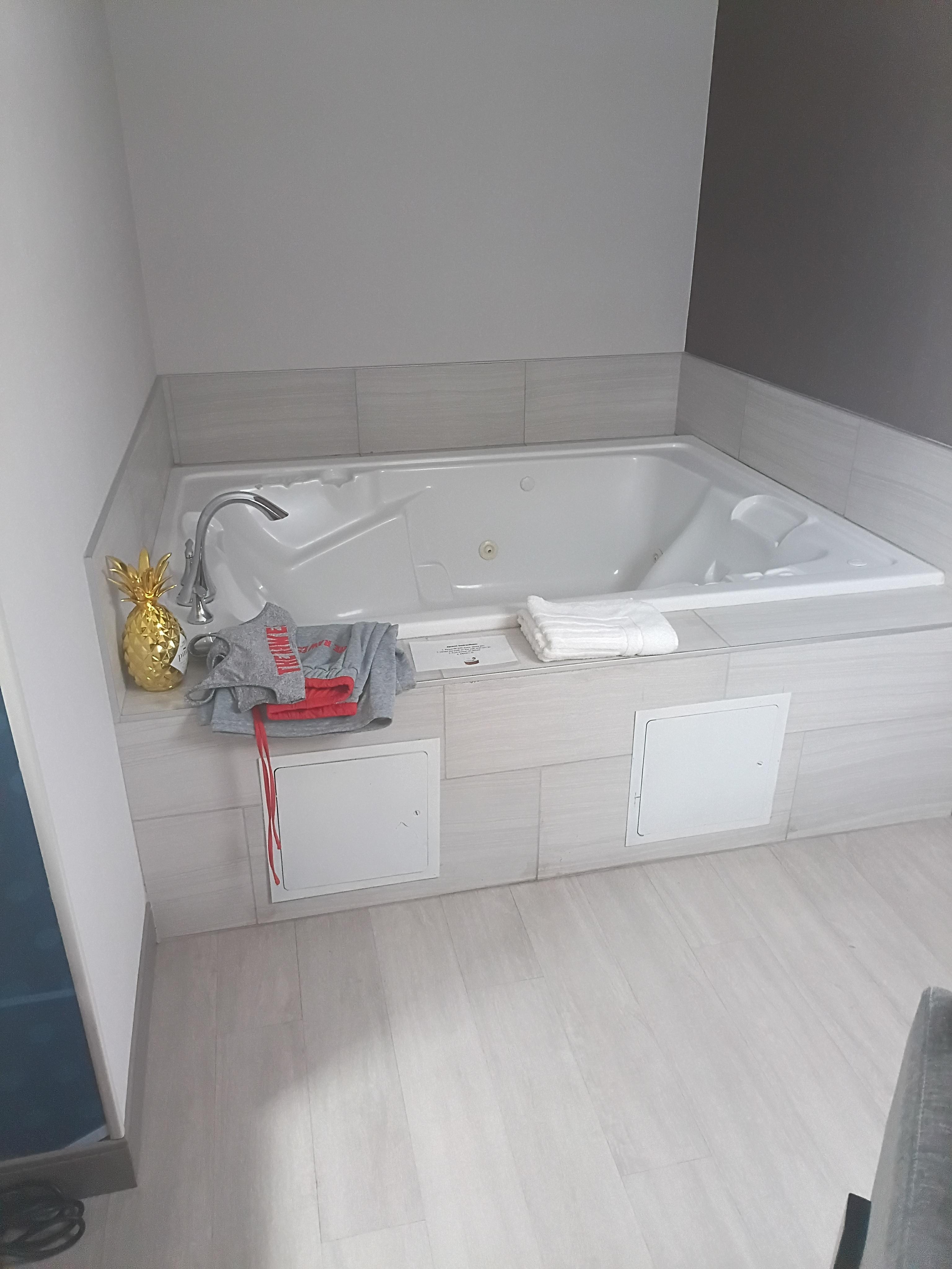 Hot tub ! I get it a Jacuzzi but honestly fits 2 tall people.  I swear it is big enough to fit 3 laying or 4 sitting cross cross.hope it helps with size idea.