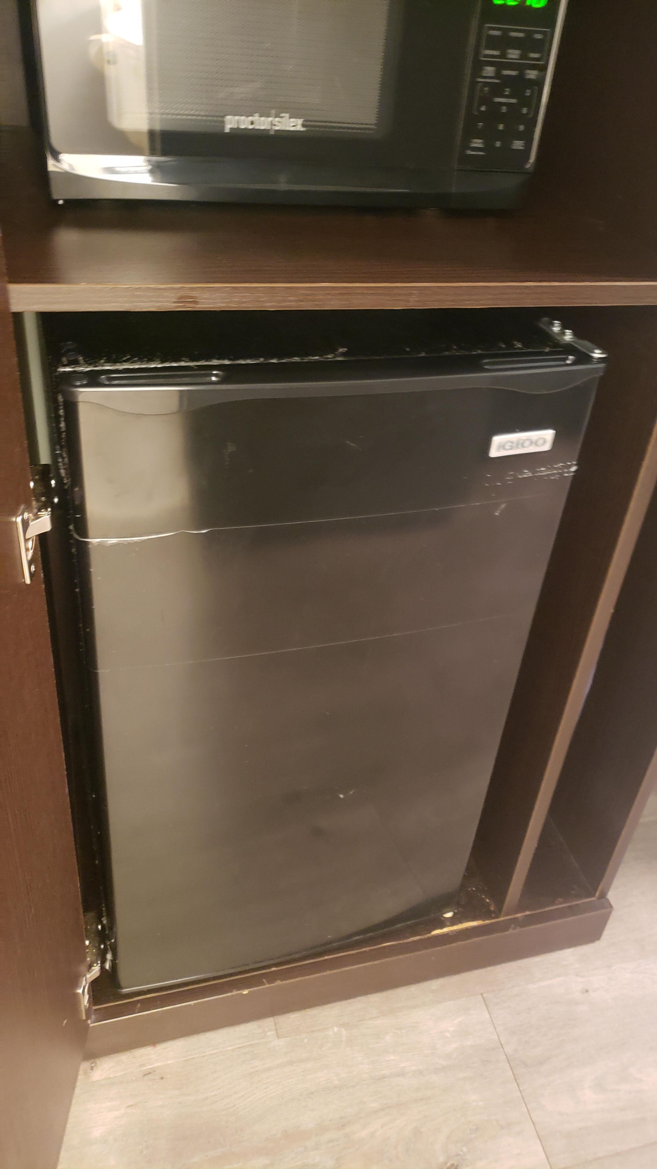 Damaged fridge and furniture.