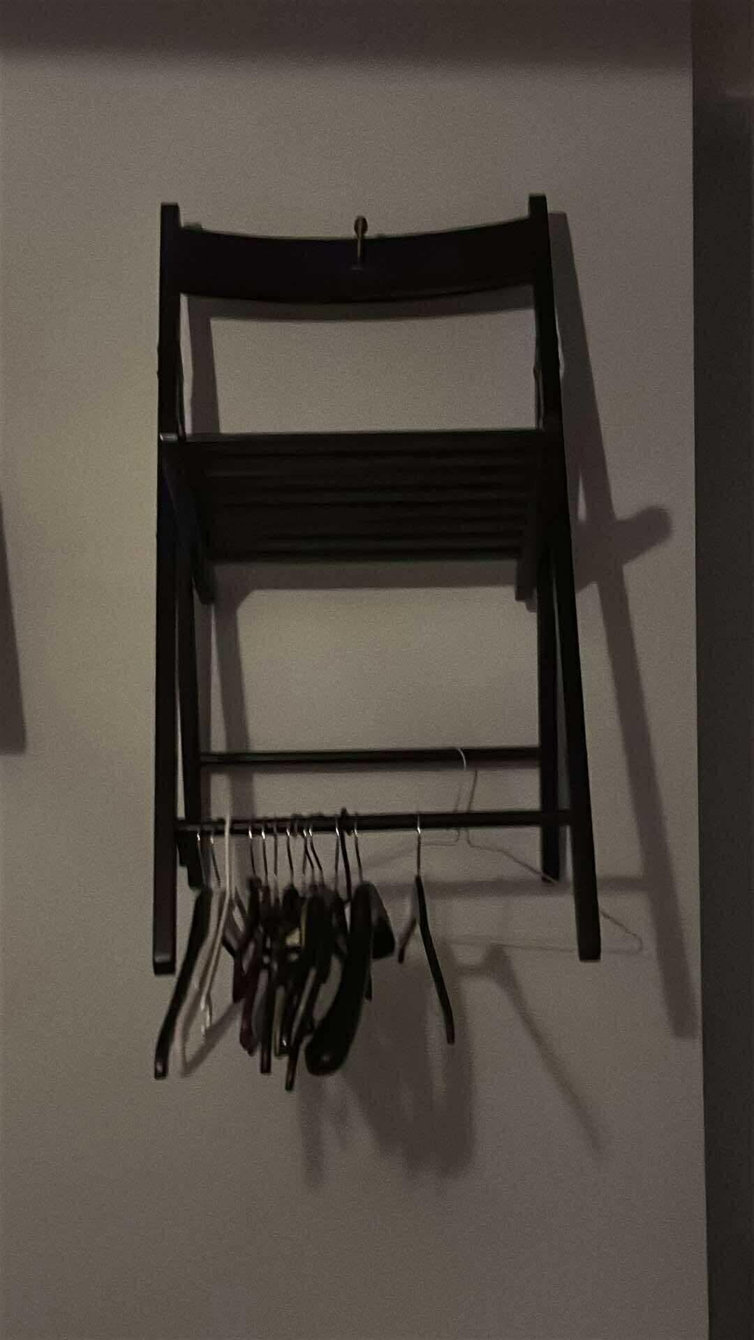 Chair on wall clothes hanger