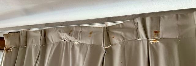 Holes in worn curtains