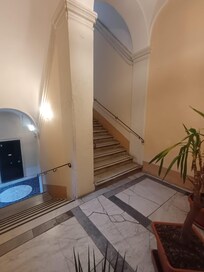 Stairs to reception. There is an elevator (tiny), but not on floor level.