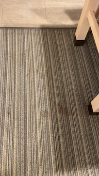 Red stain on carpet