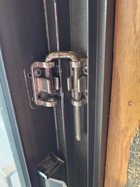 This is the makeshift fix for the sliding glass door. The picture above, shows another angle of how far the door still opens even with this on. Can easily be picked open.