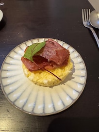 Freshly prepared scrambled egg with bacon
