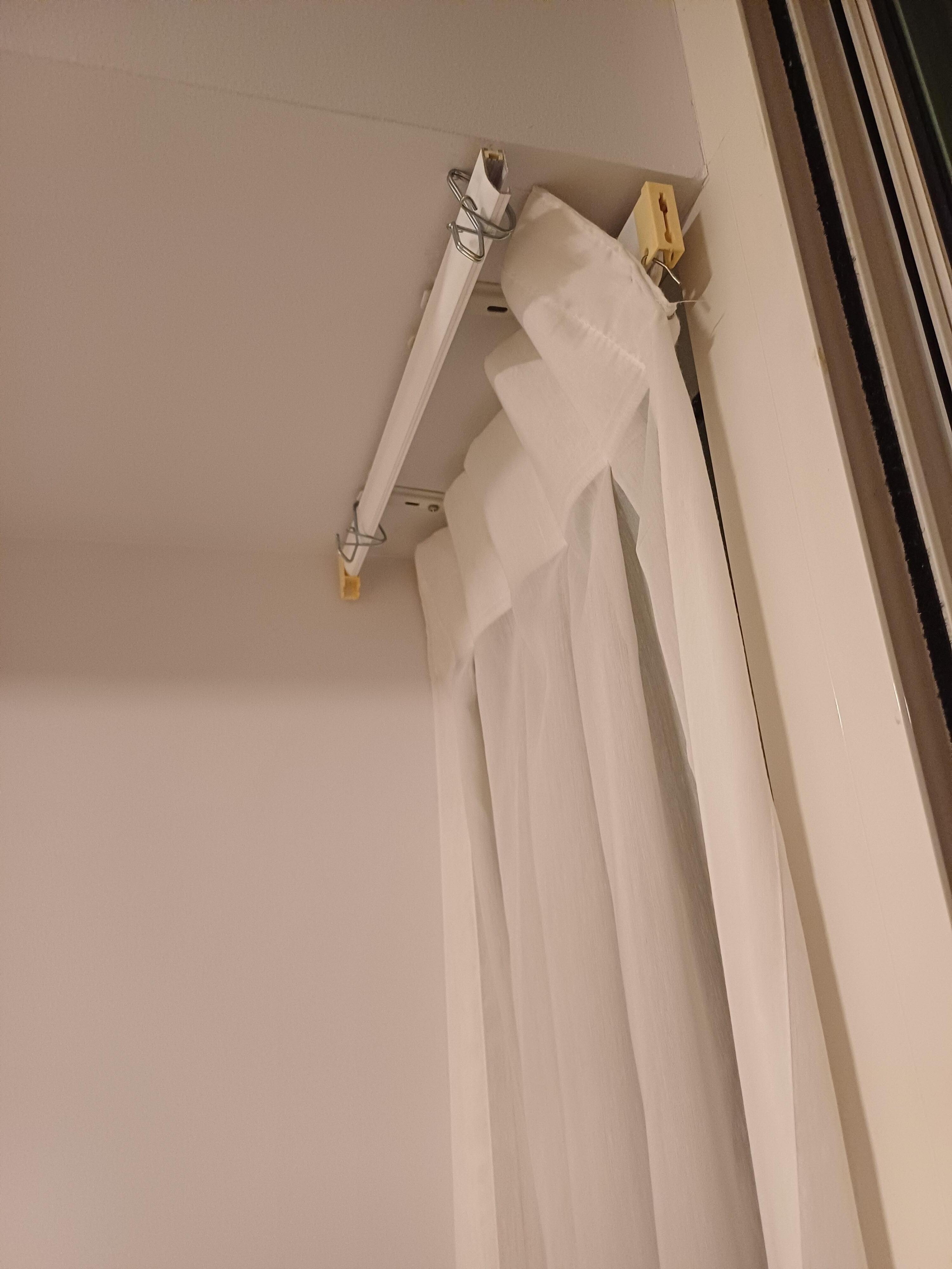 missing curtain in main bedroom on side of sliding doors. sheer curtain was the only curtain here