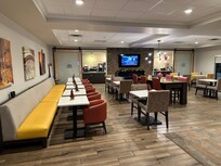 Breakfast room was expansive with TV and artificial fireplace.