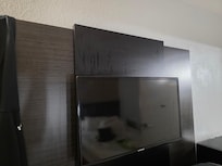 Something gross left all over wall behind tv