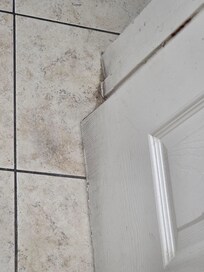 Bottom of the bathroom door. It was nasty.