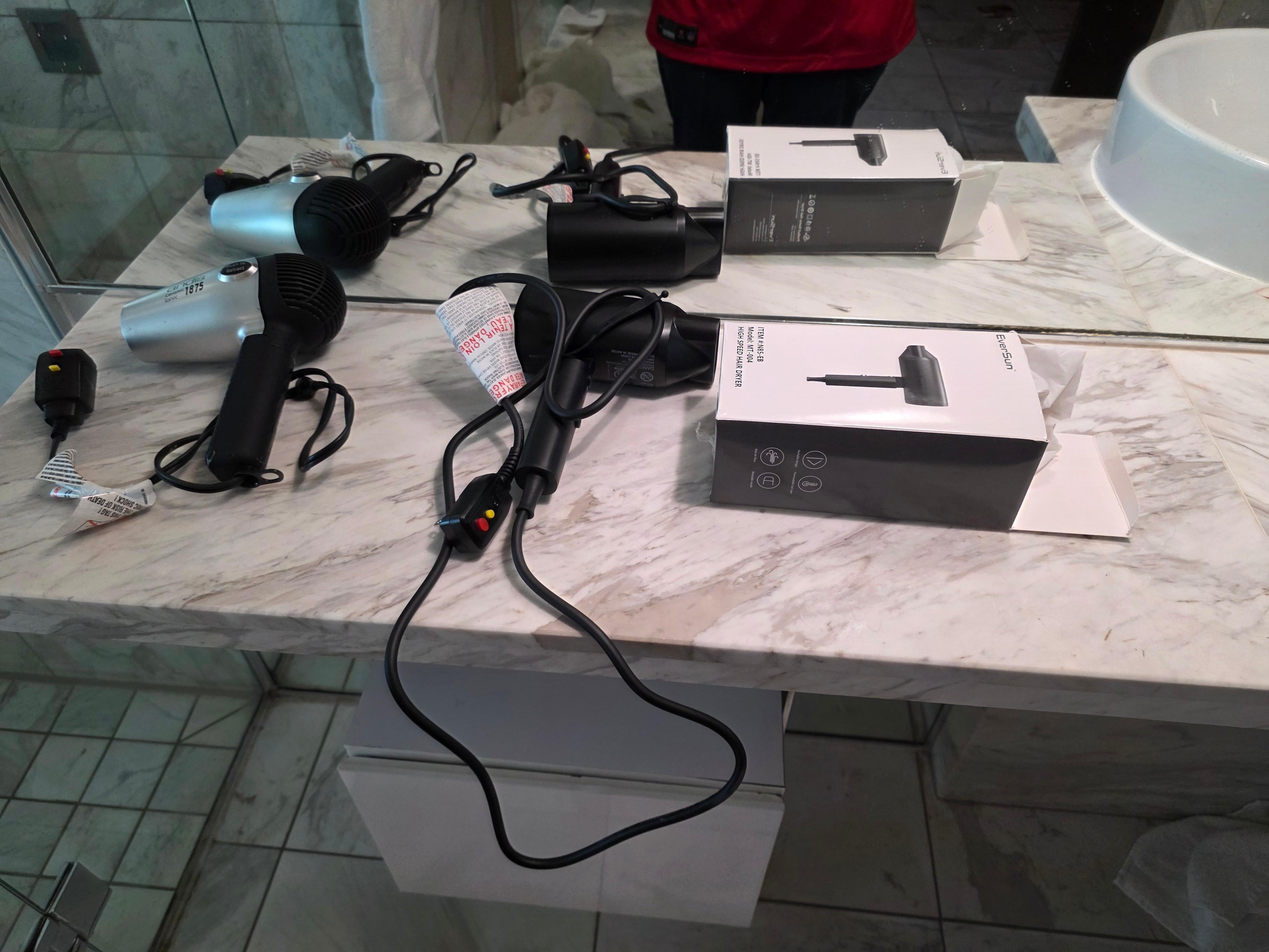 The hair dryer on the left came with the room. It didn't work. Ask front desk for a new one. Since this is a privately owned condo, the hotel charged us $32 to rent one.