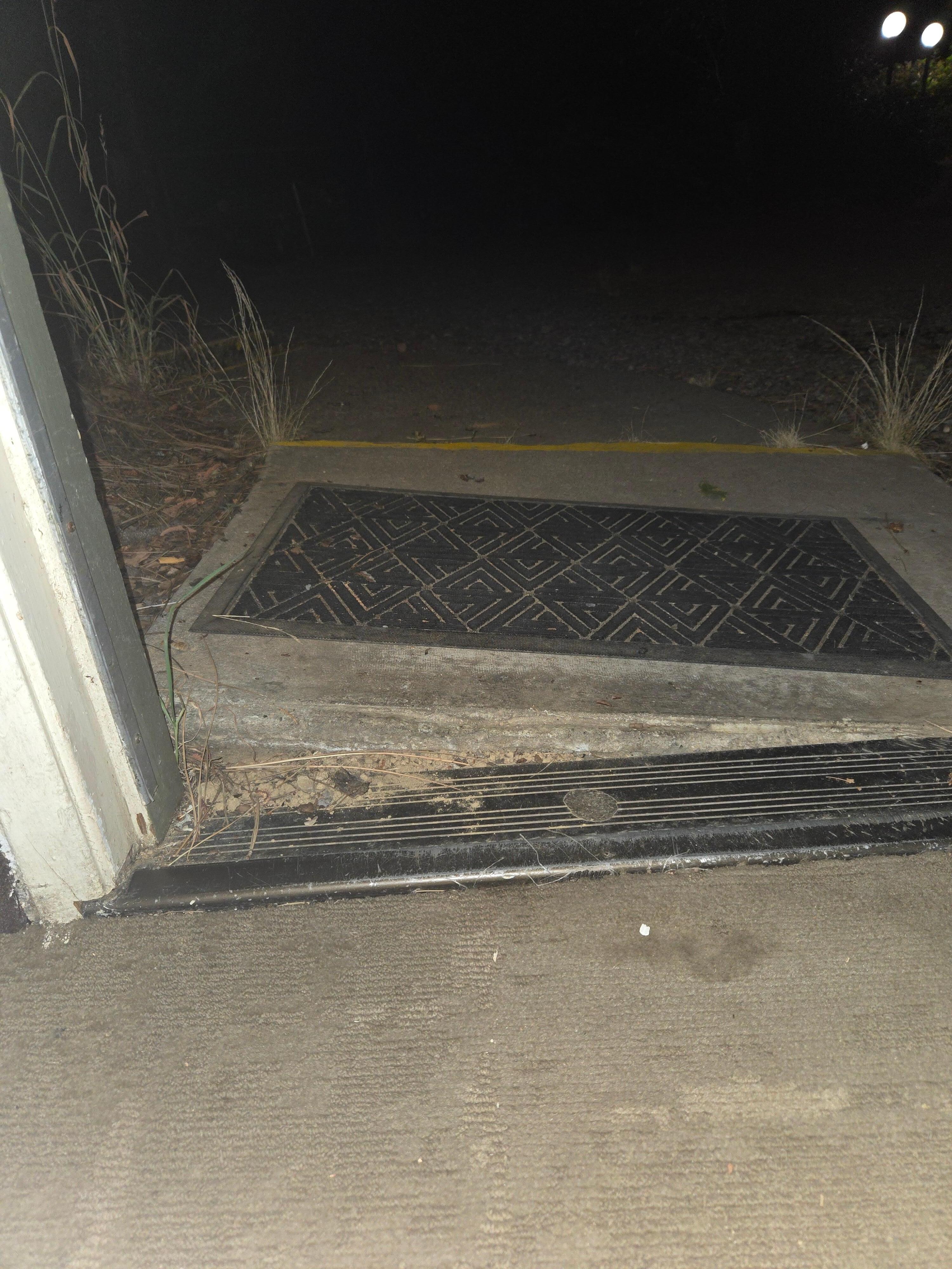 The slanted concrete step into the room