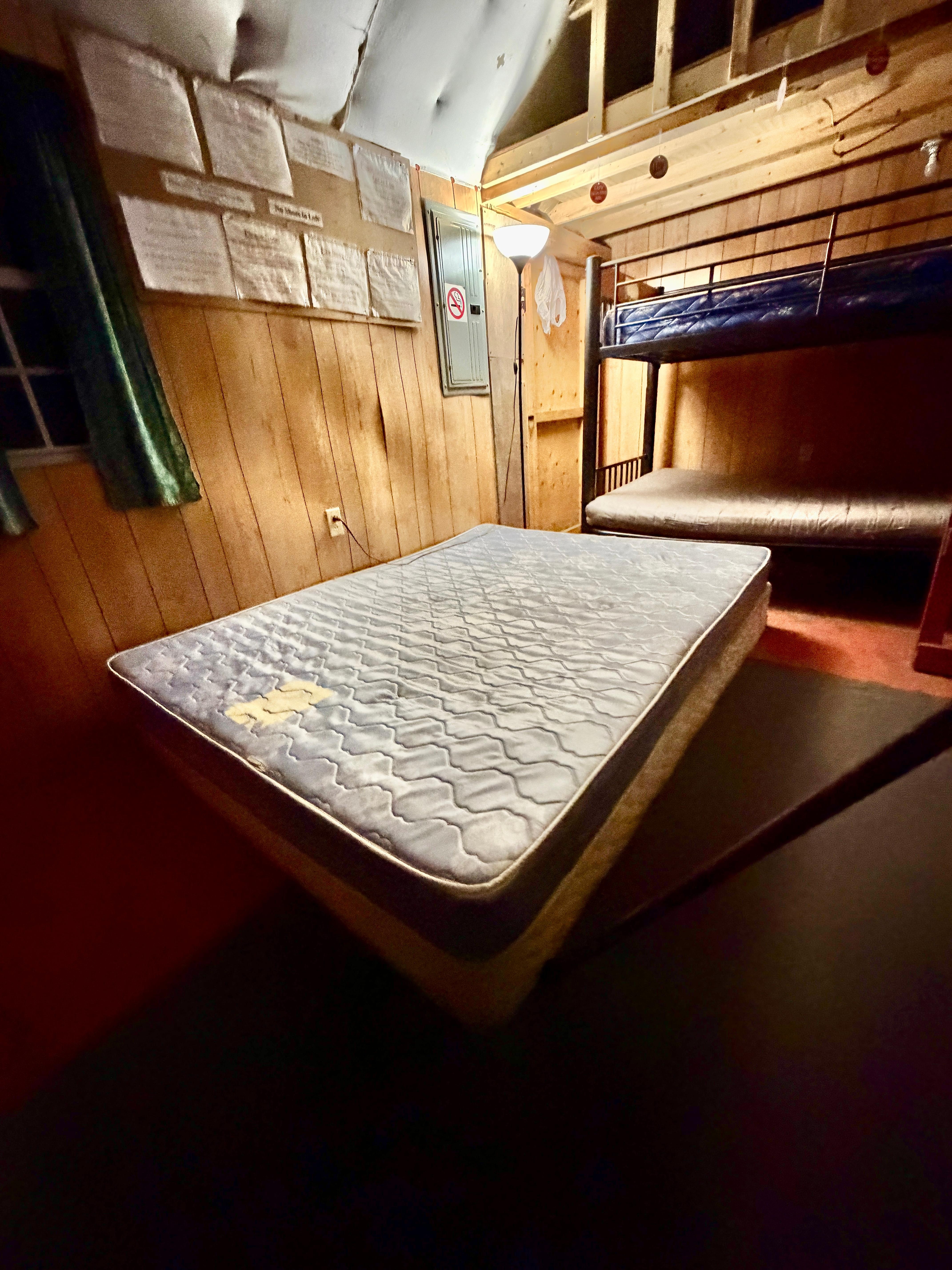“Queen Bed” is two queen mattresses on the floor. 