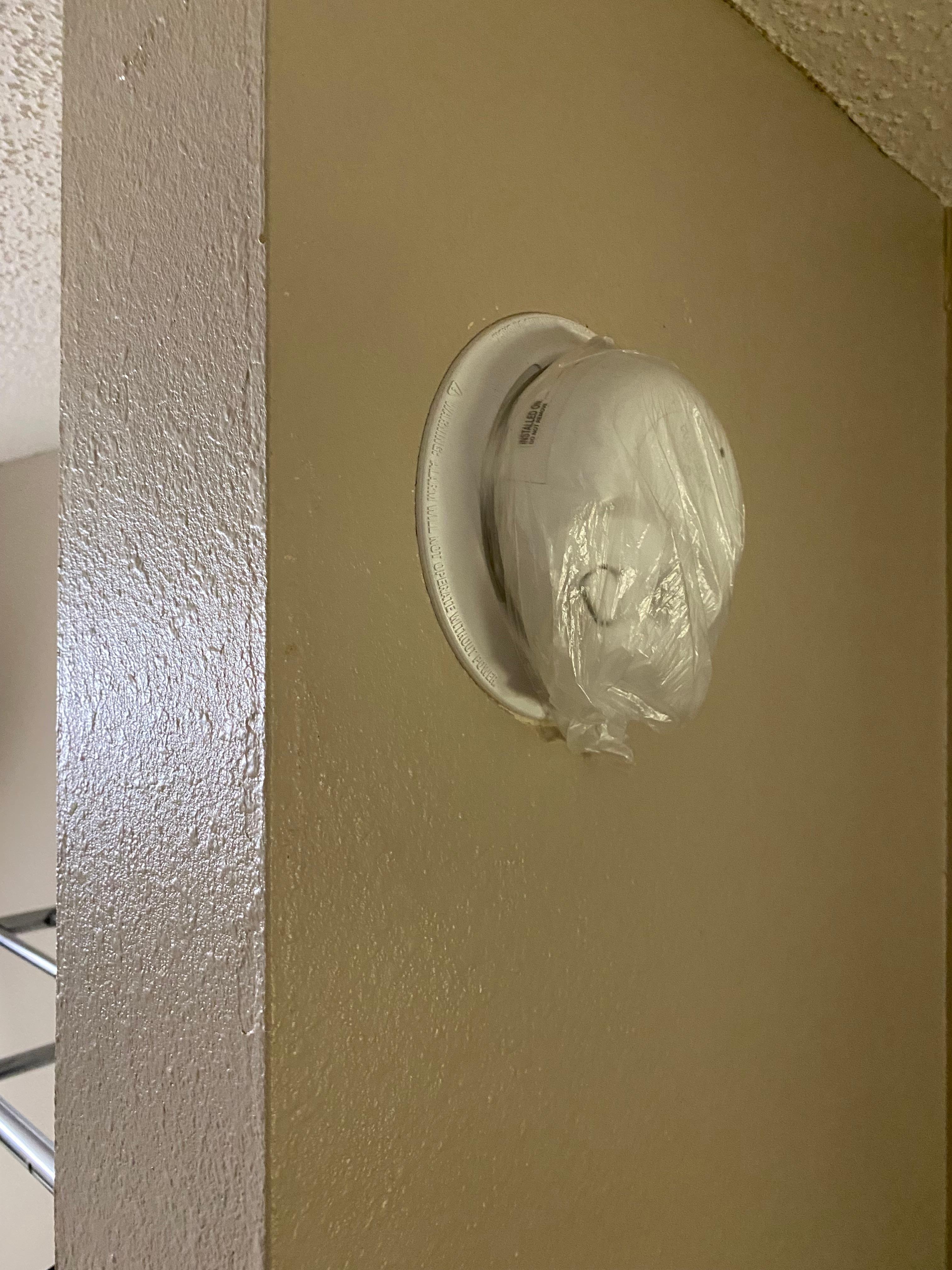 Smoke detector sealed off with a drink cup baggie