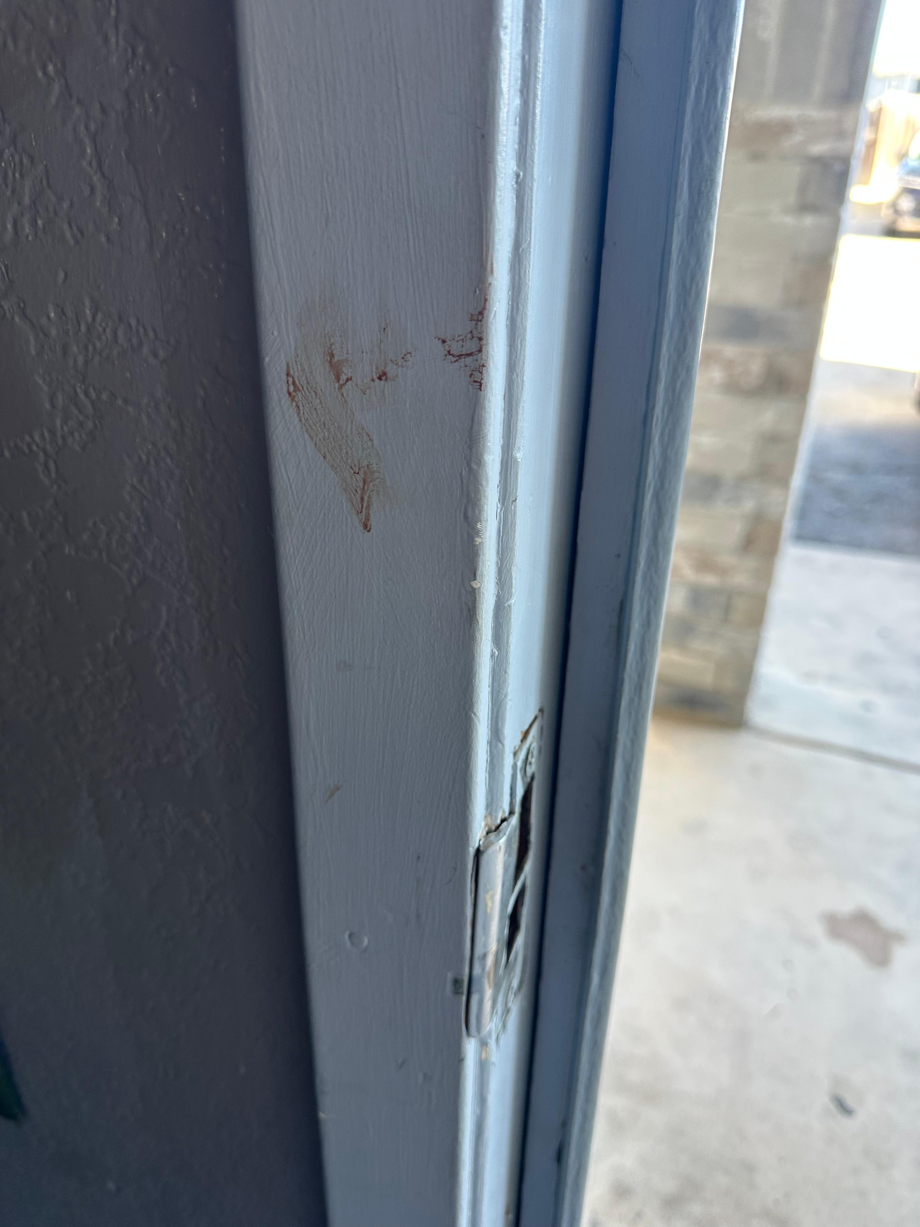 Blood smear on door frame 