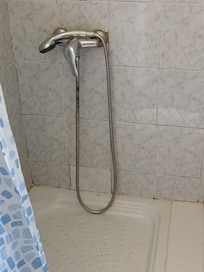 Very dated. Needs serious attention
Very small with old fashioned curtain.