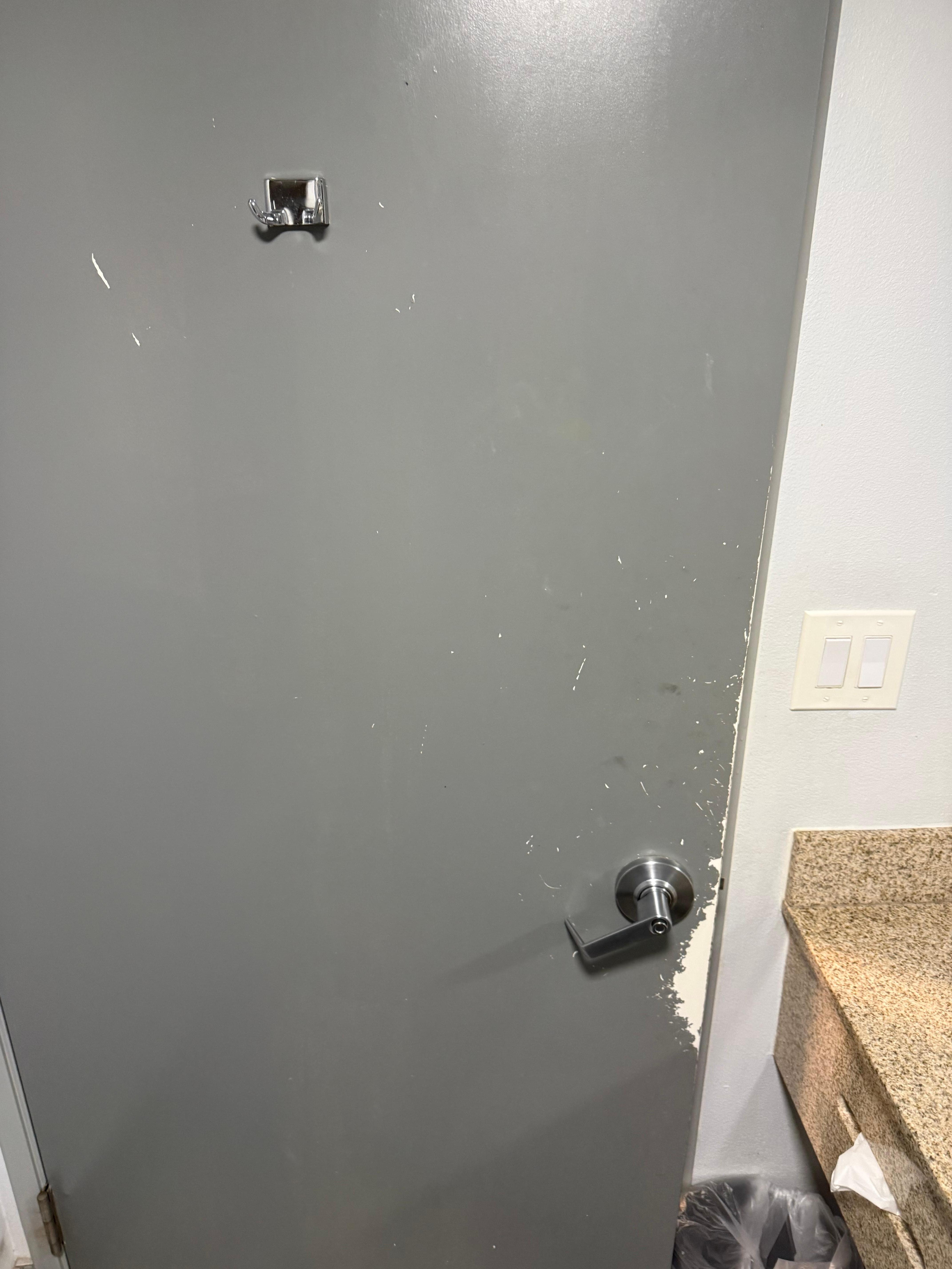 Bathroom door scratched and handle broken 