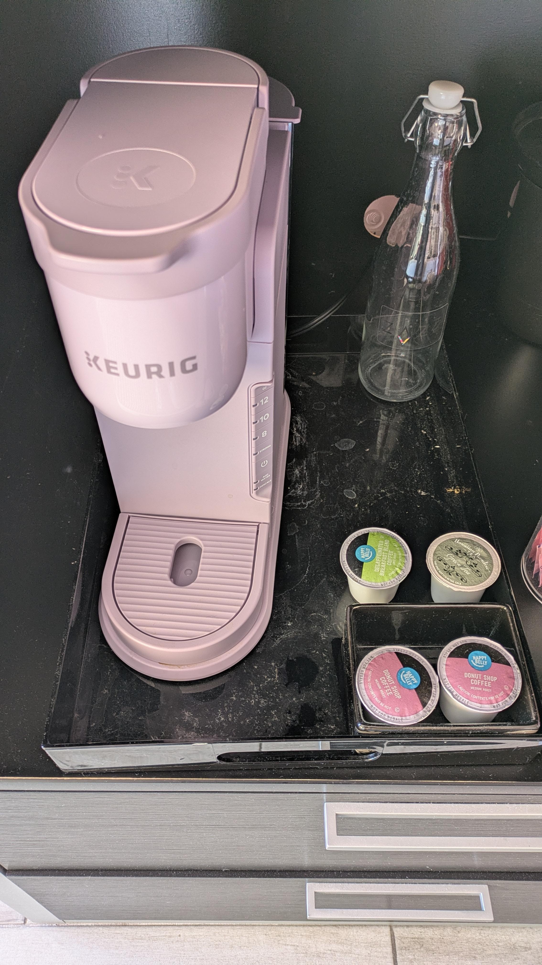 The tray on which the coffee machine sat was covered in lime scale and was dusty to boot.