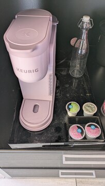 The tray on which the coffee machine sat was covered in lime scale and was dusty to boot.