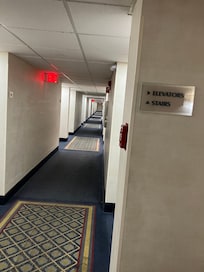 Got off elevator and had to walk to other end of building after telling the hotel clerk I could not walk very far.