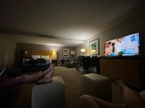 Upgraded room- on pool floor with view of roof and no chairs on narrow patio. Full dining room table - maybe good for an interview