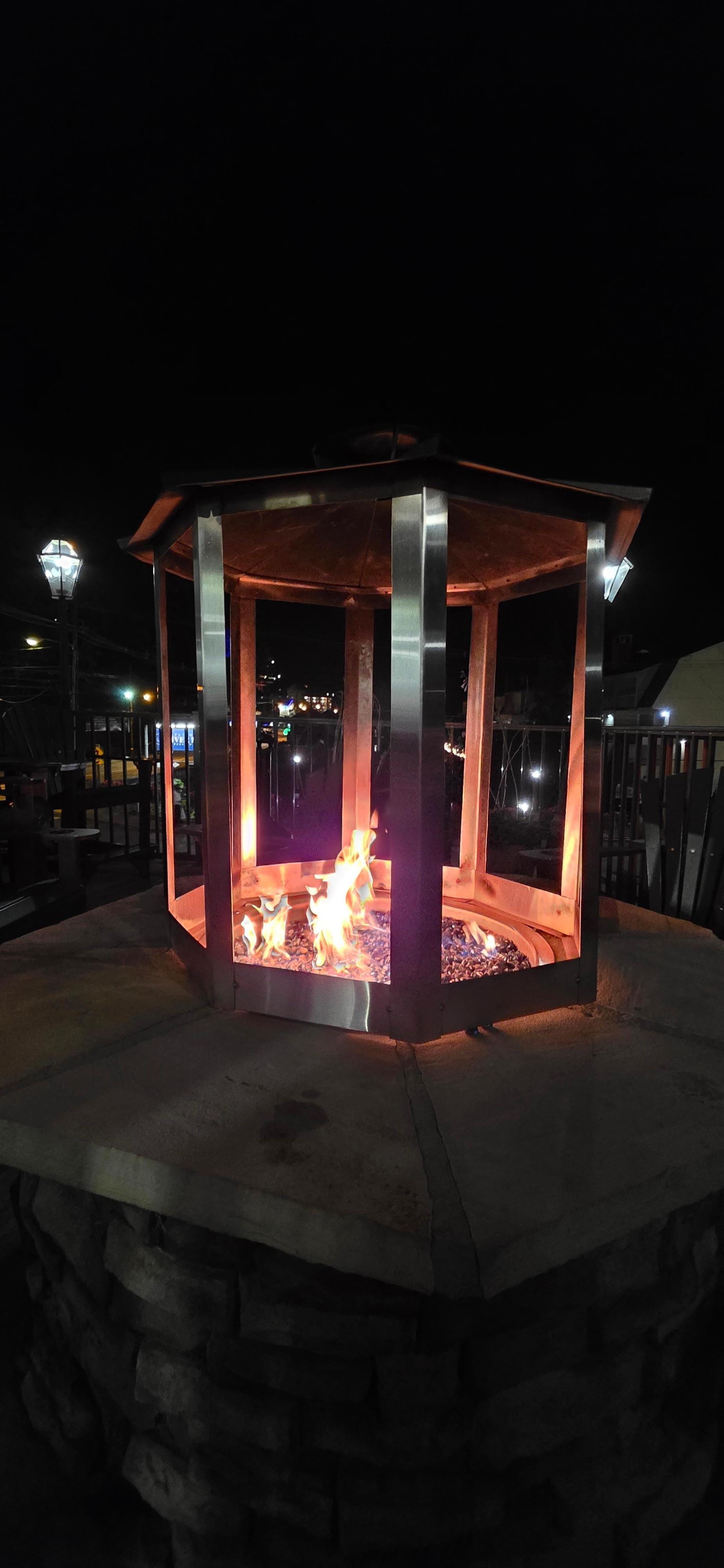 Gas firepit includes manual timer options.