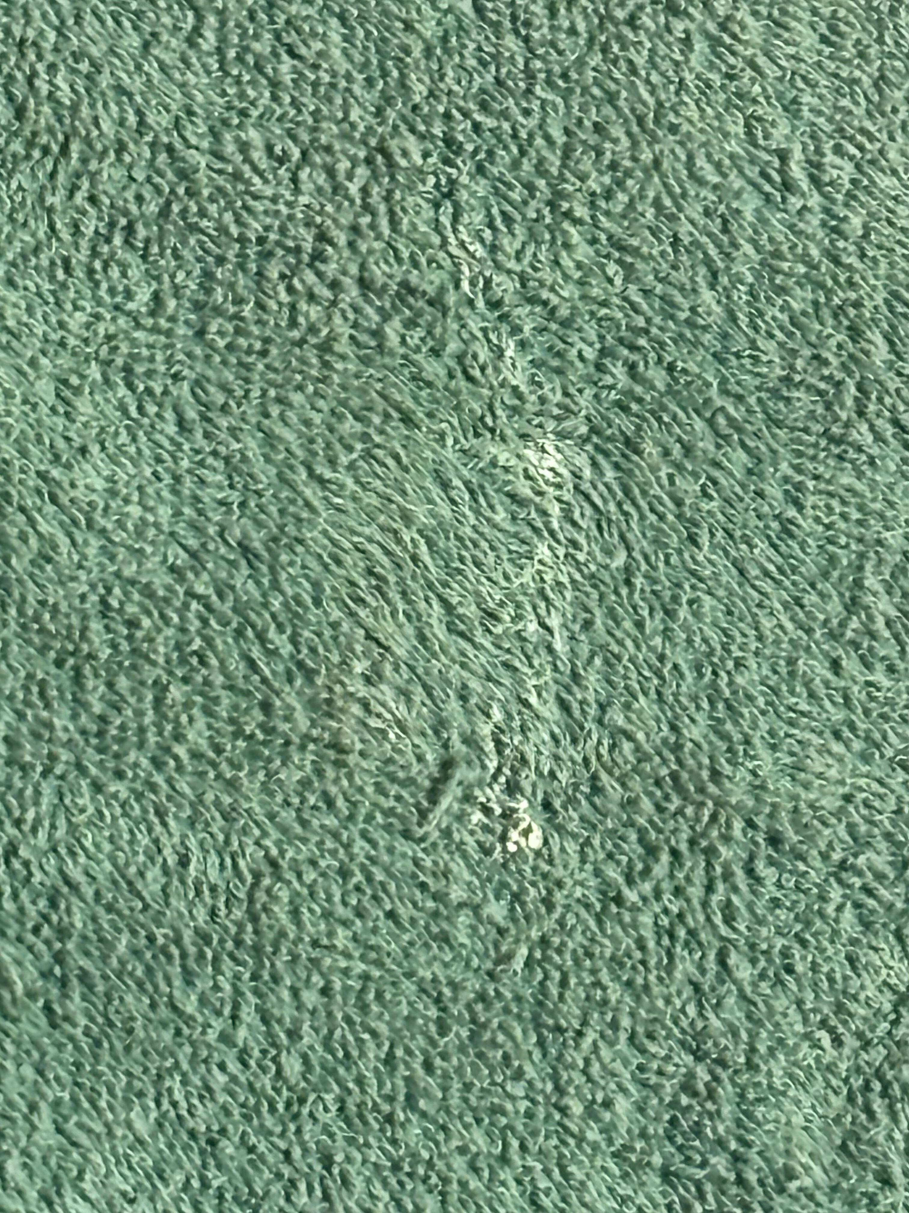Tooth paste or something on towel