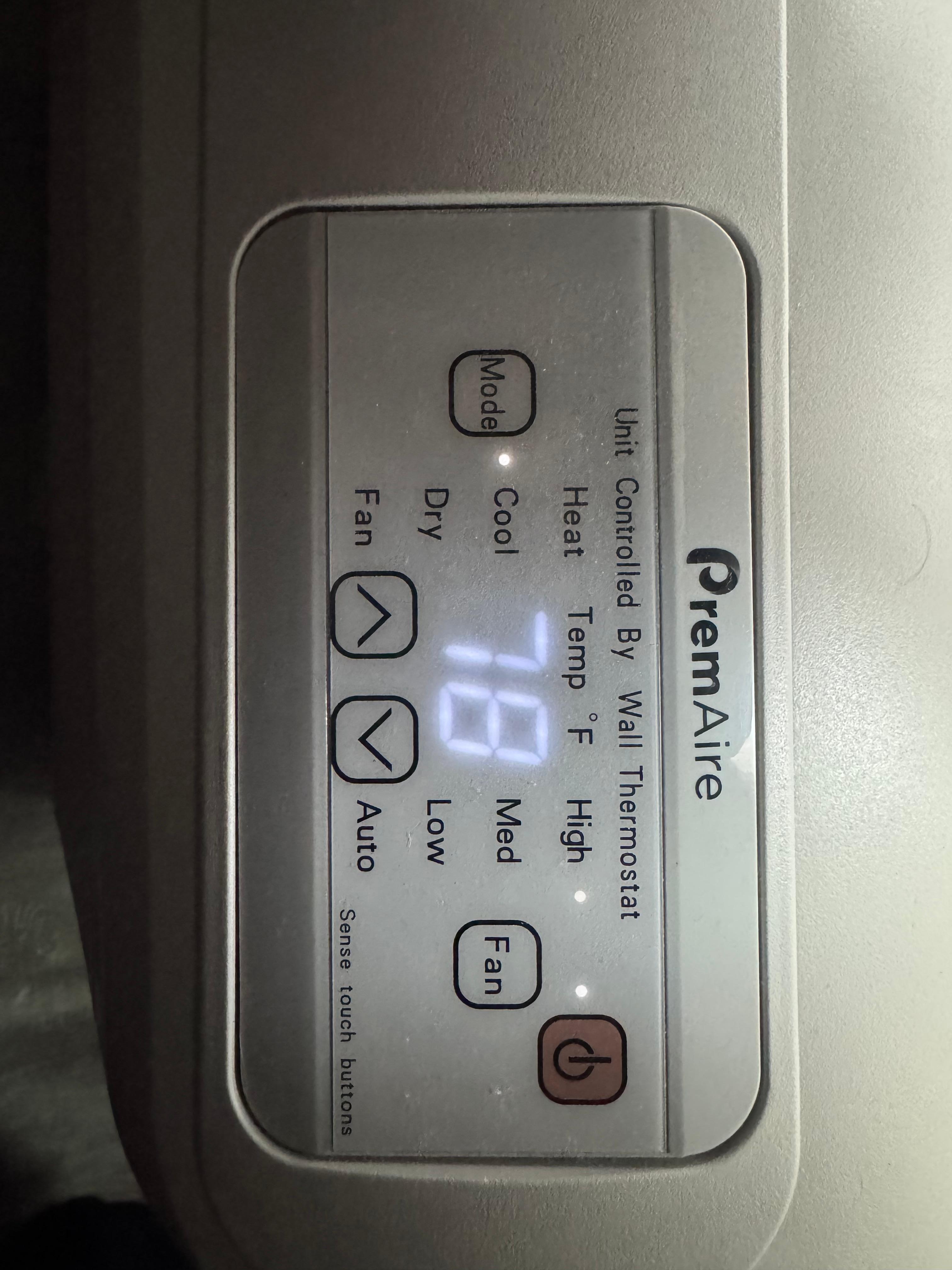 This unit cannot adjust the temp on the unit itself.  