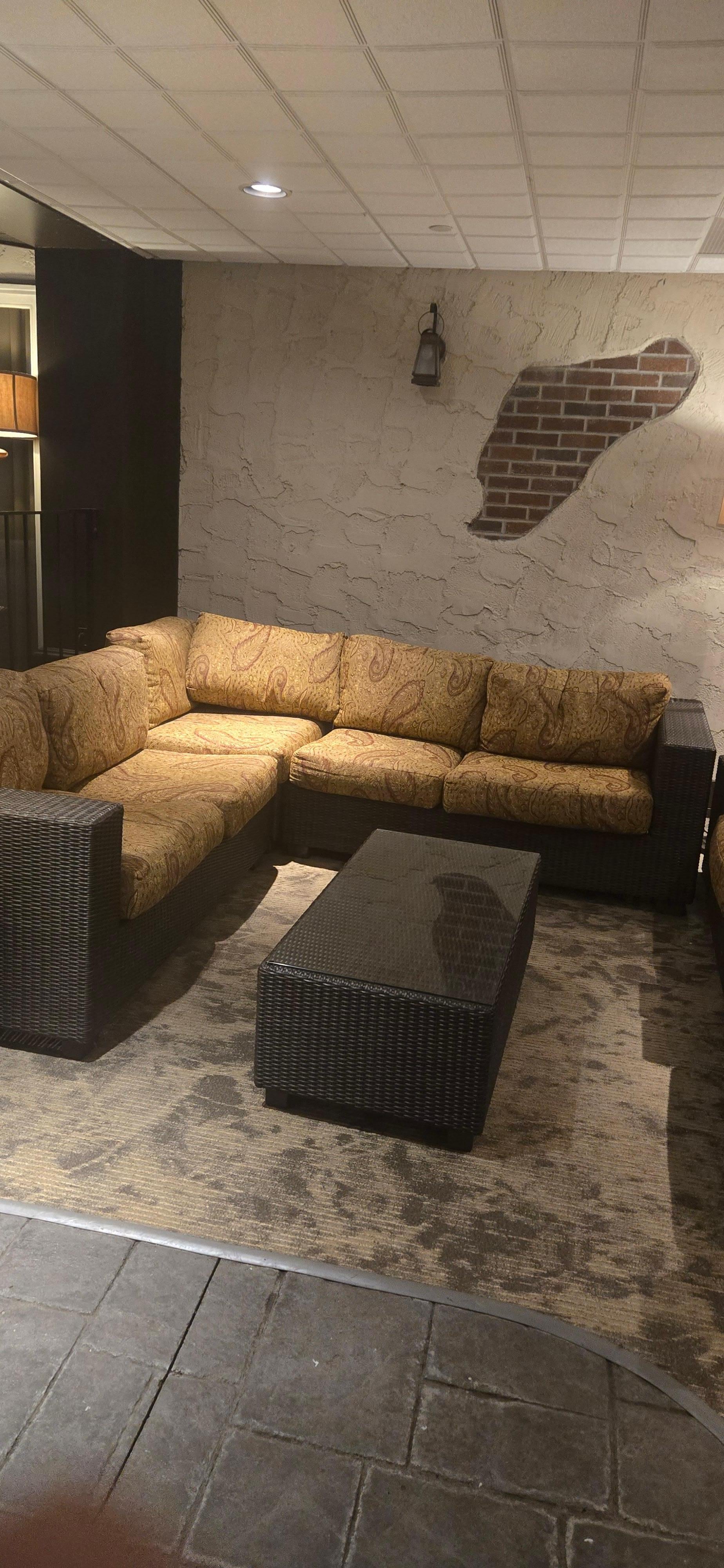 Comfy couches in pool and sauna area.