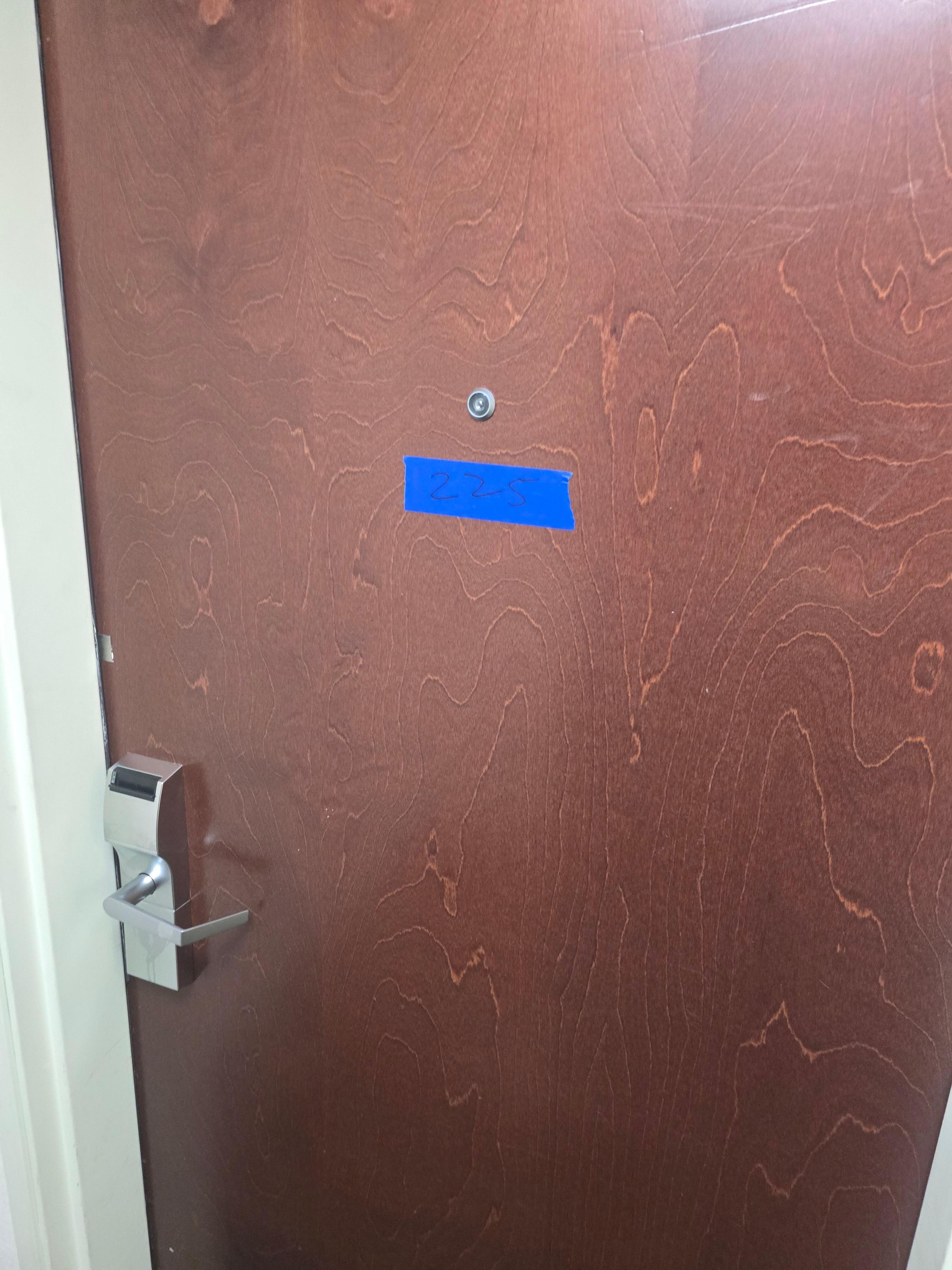 Tape on door with room number