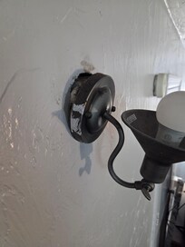 light out of service and hanging out from wall