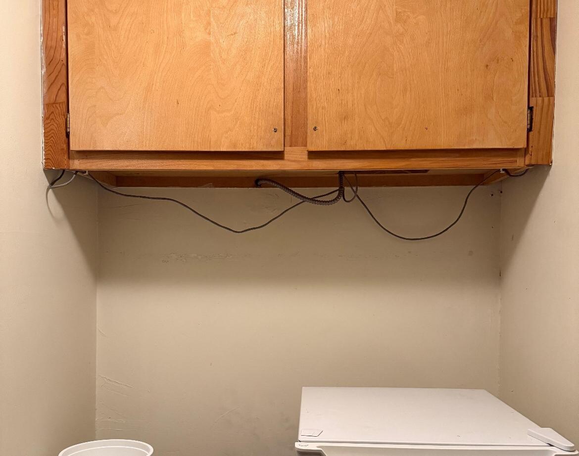 Cat5 cables hanging out of locked cabinet if your gonna spy at least be discreet 