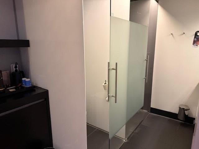 Better to have a door to give more privacy for both wash and shower rooms