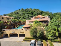 The view of Herby's sports bar, Pineapple villa breakfast, and Pina spa. Elevator located in the garage.