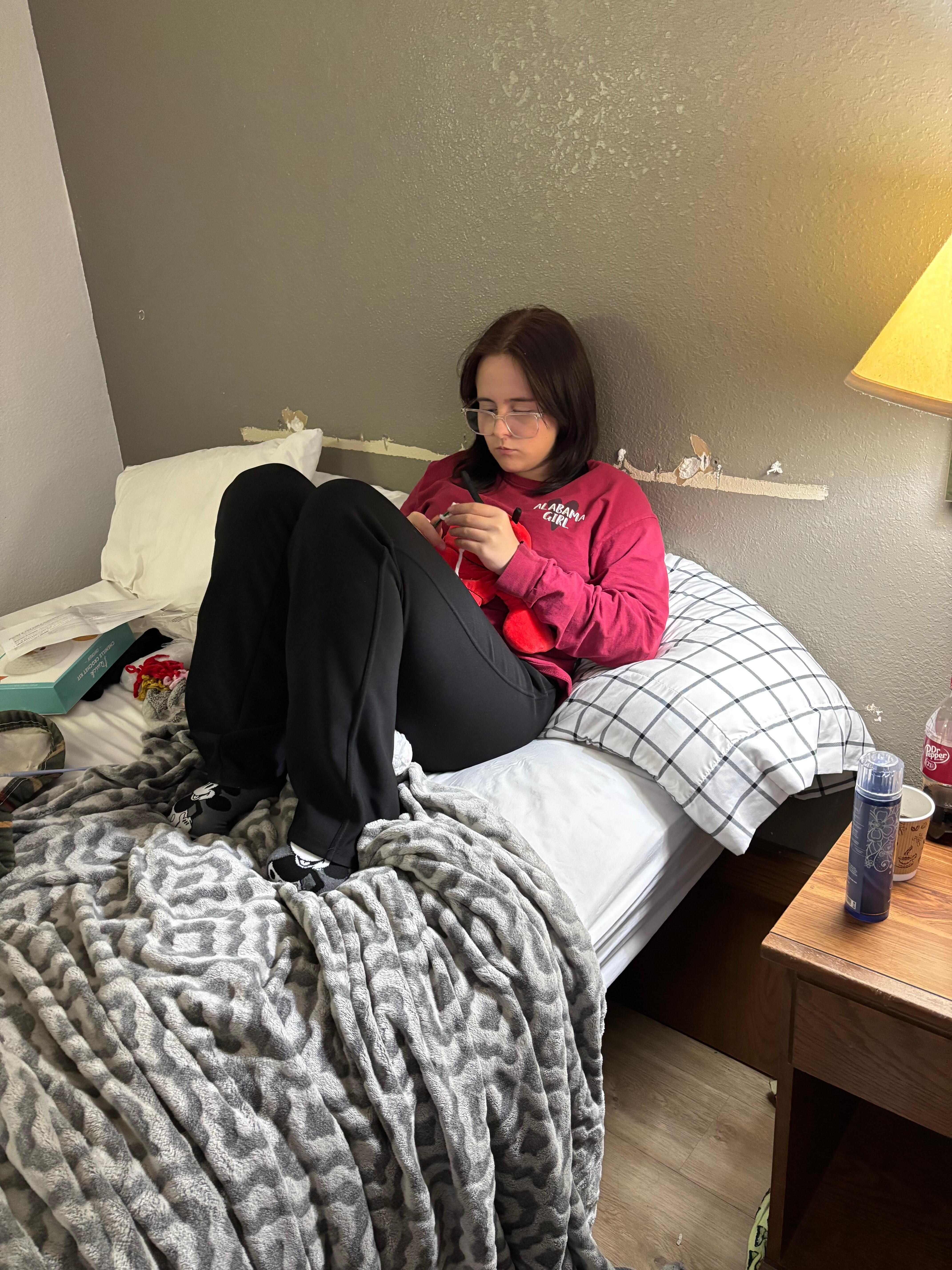 Holes in the wall behind my daughter with toilet paper shoved in it