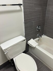 Lid didn’t cover toilet tank, hole at base of tub, inside bowl not cleaned with a brush as left over poo in 3 spots lifting lid.